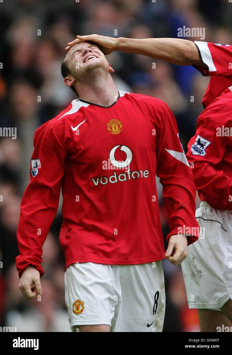 Manchester United's Wayne Rooney looks to the heavens as Rio Ferdinand ...