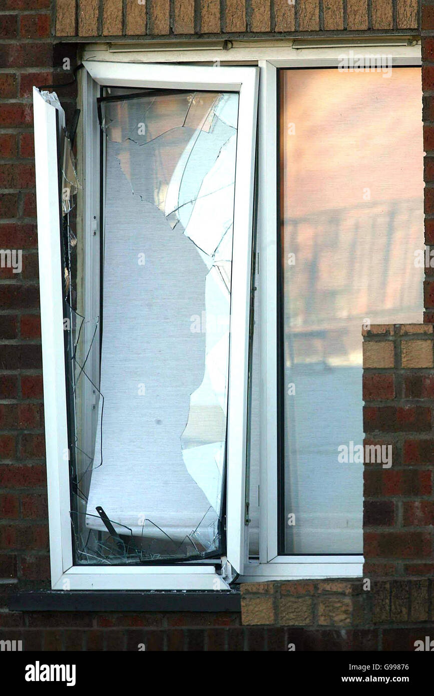 A smashed window at the house where a man was stabbed to death on ...