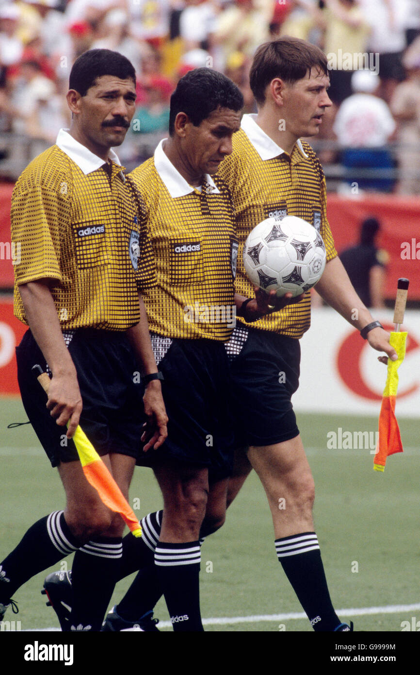 Referee Jose Joaquin Torres (c) walks out to the centre with his two ...