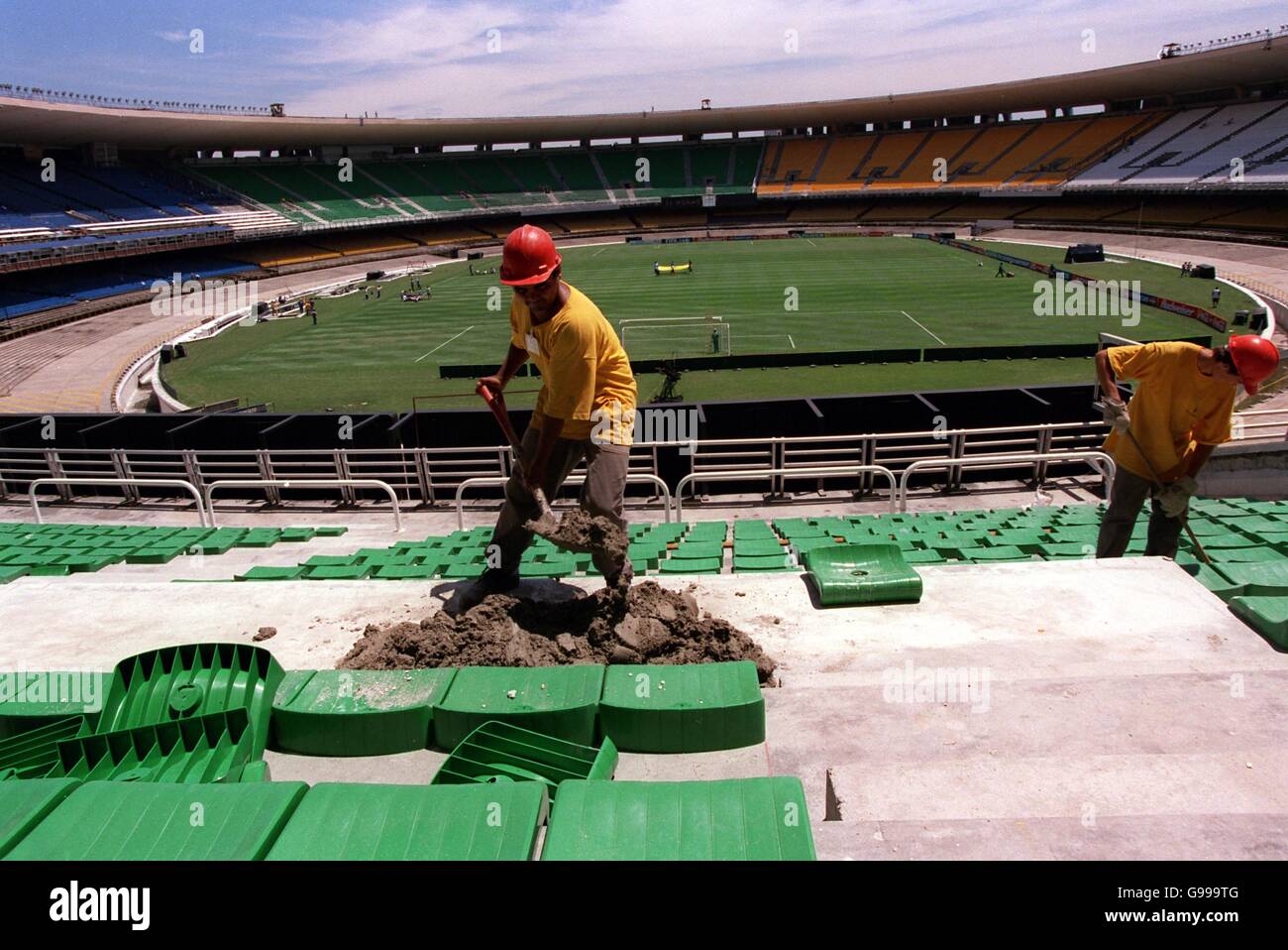 Workmen finish off the Maracana Stadium in Rio de Janeiro before ...