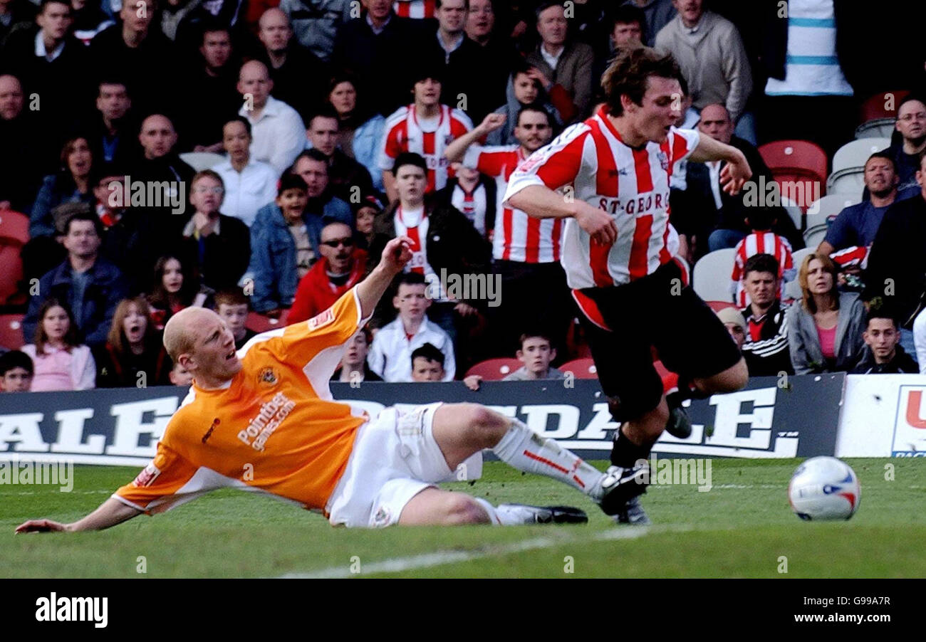 SOCCER Brentford. Brentford's Jay Tabb (R) is brought down by Blackpool ...