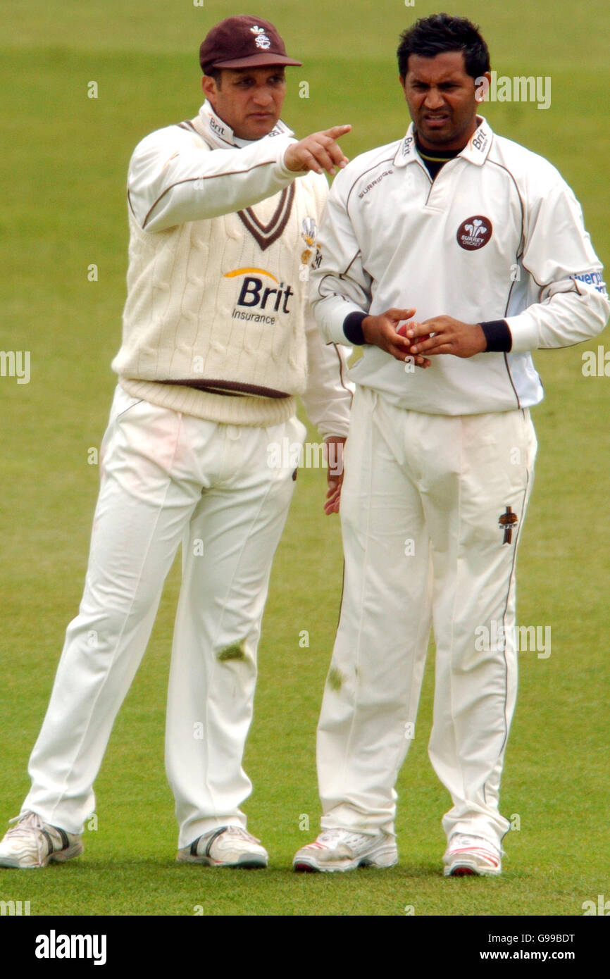 Surrey's Nayan Doshi receives direction from captain Mark Butcher Stock ...