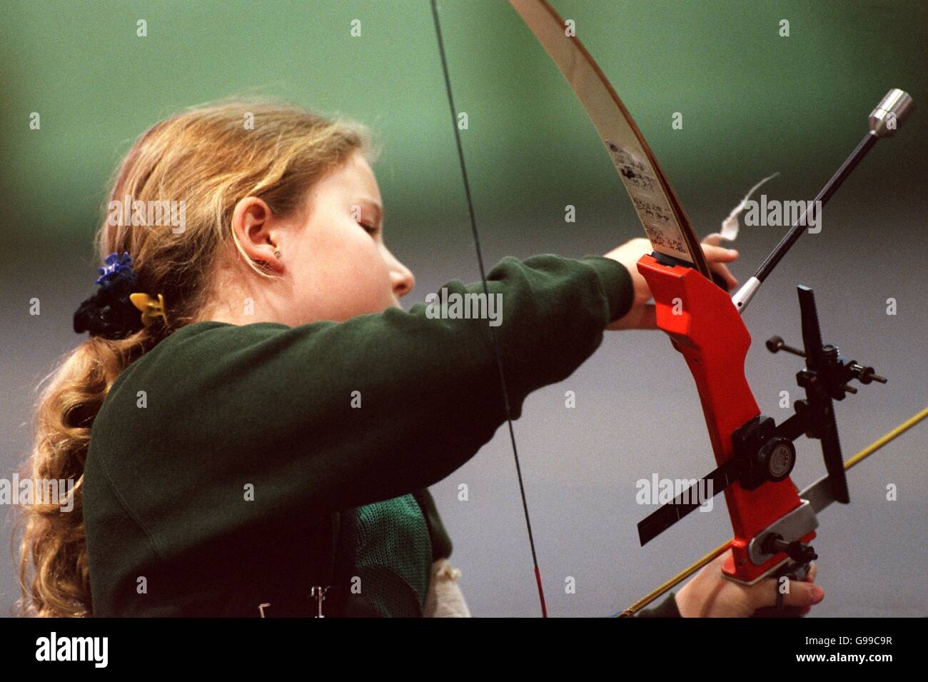 Archery - National Indoor Championships. A young archer adjusts the ...