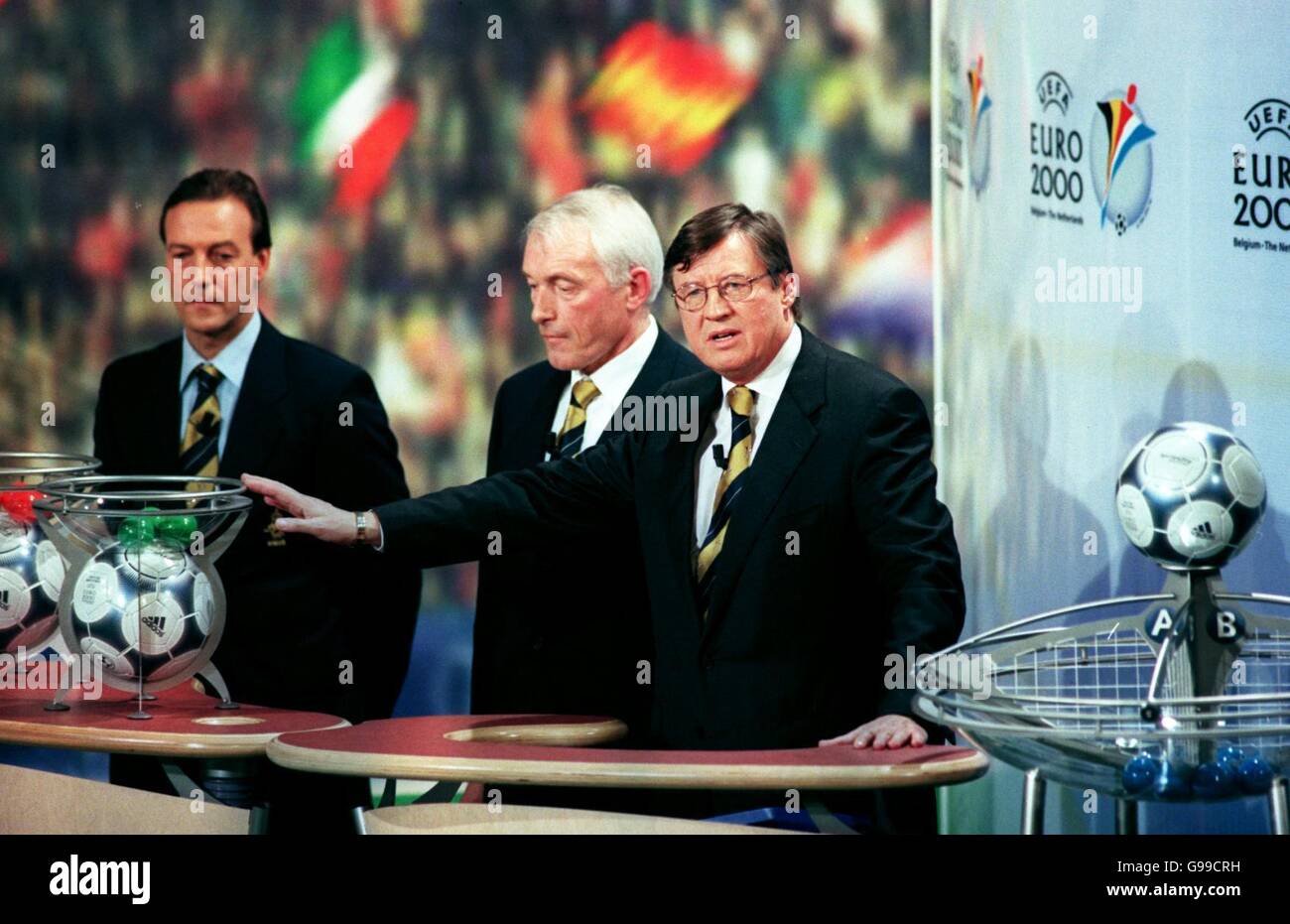 UEFA general secretary Gerhard Aigner (right) conducts the draw, with ...