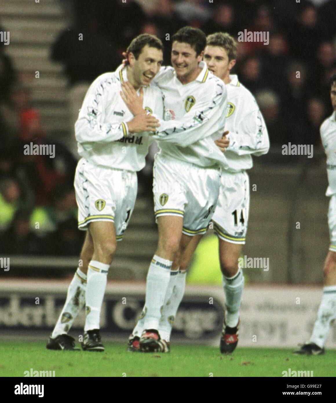 Leeds United's Jason Wilcox (l) celebrates with Michael Bridges (c ...