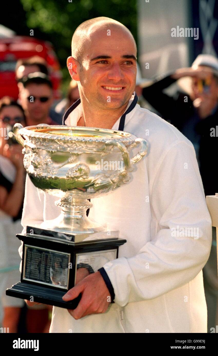 Andre agassi shows off the australian open trophy hi-res stock ...