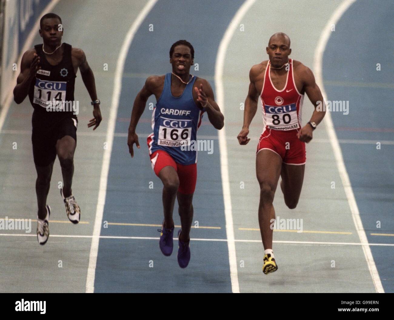 Christian Malcolm (blue) wins the Men's 200m and sets the fastest time ...