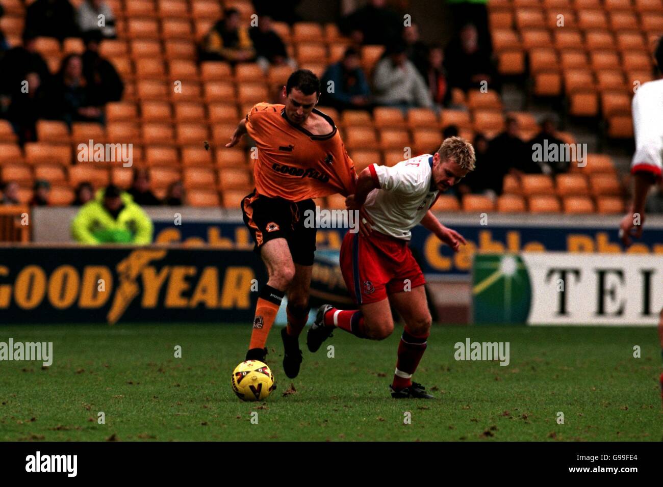 Wolverhampton Wanderers' Kevin Muscat (l) is challenged by Crystal ...