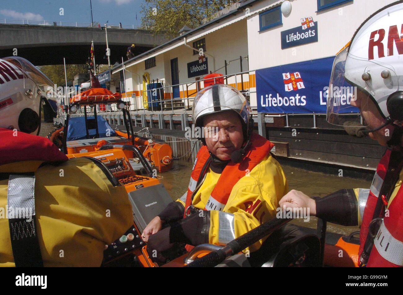 Royal National Lifeboat Institute (RNLI) crewmen John Donaghy (centre ...