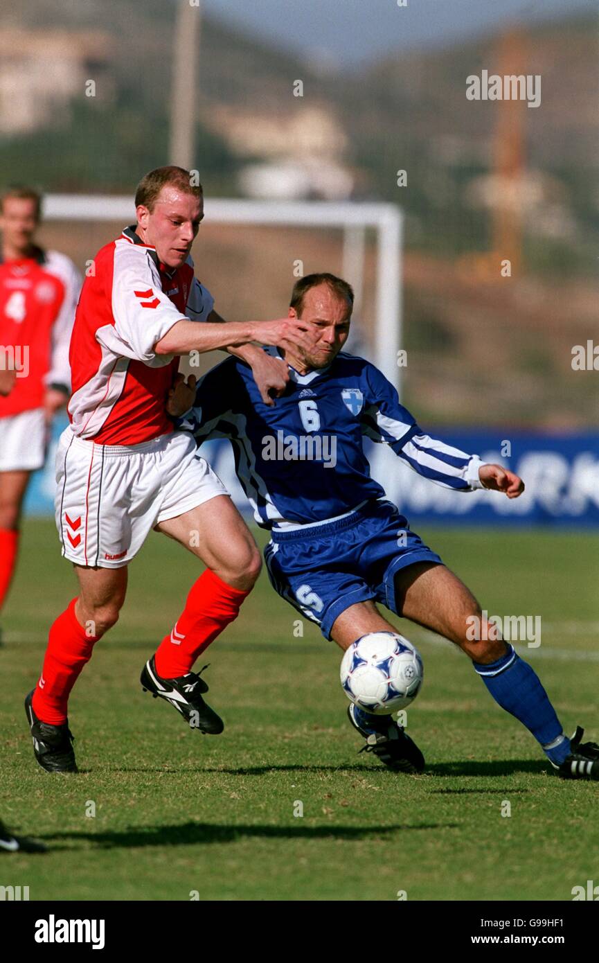 Finland's Tommi Gronlund (r) tries to hold off Denmark's Kim Daugaard ...
