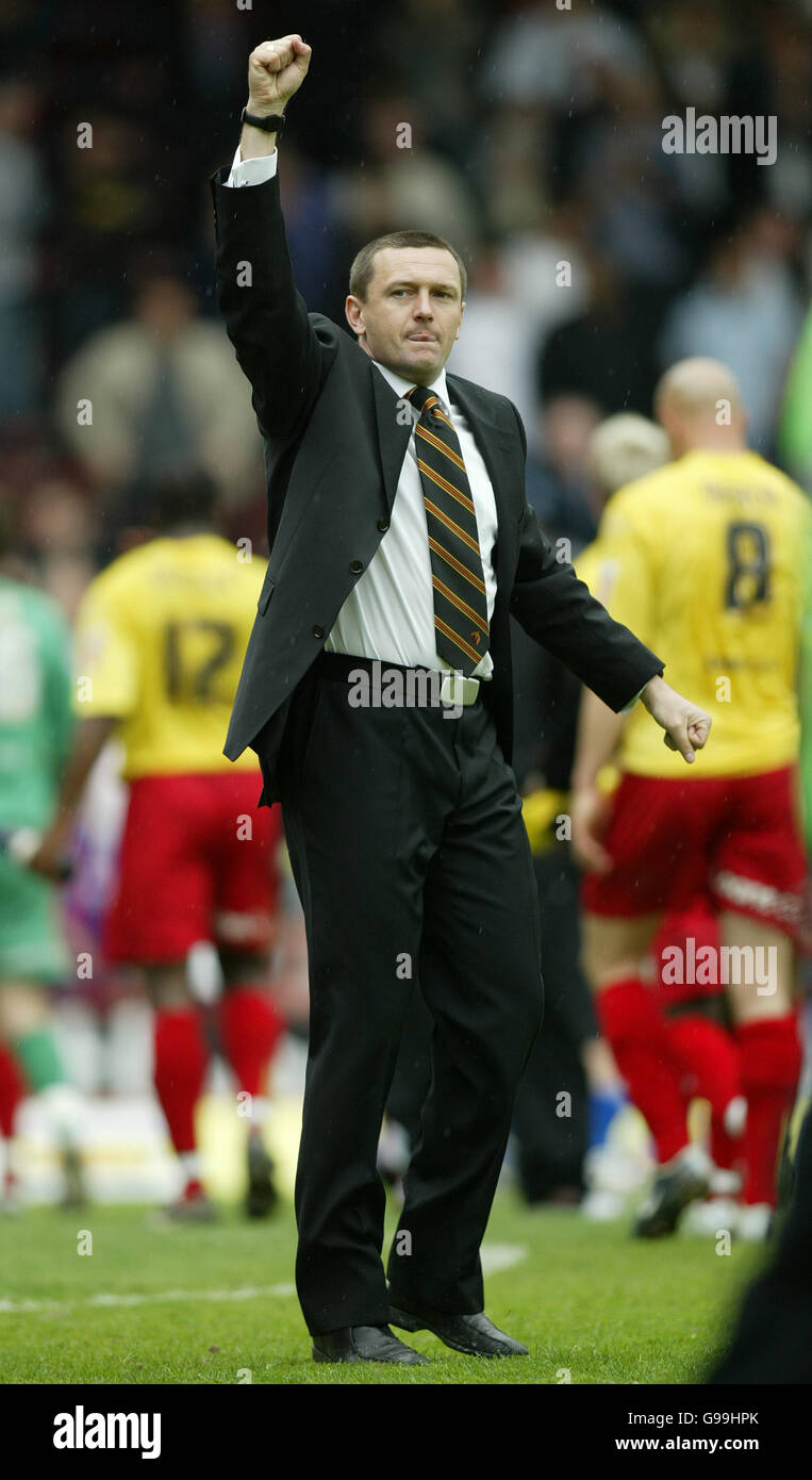 Watford's manager Adrian Boothroyd salutes the traveling fans after ...