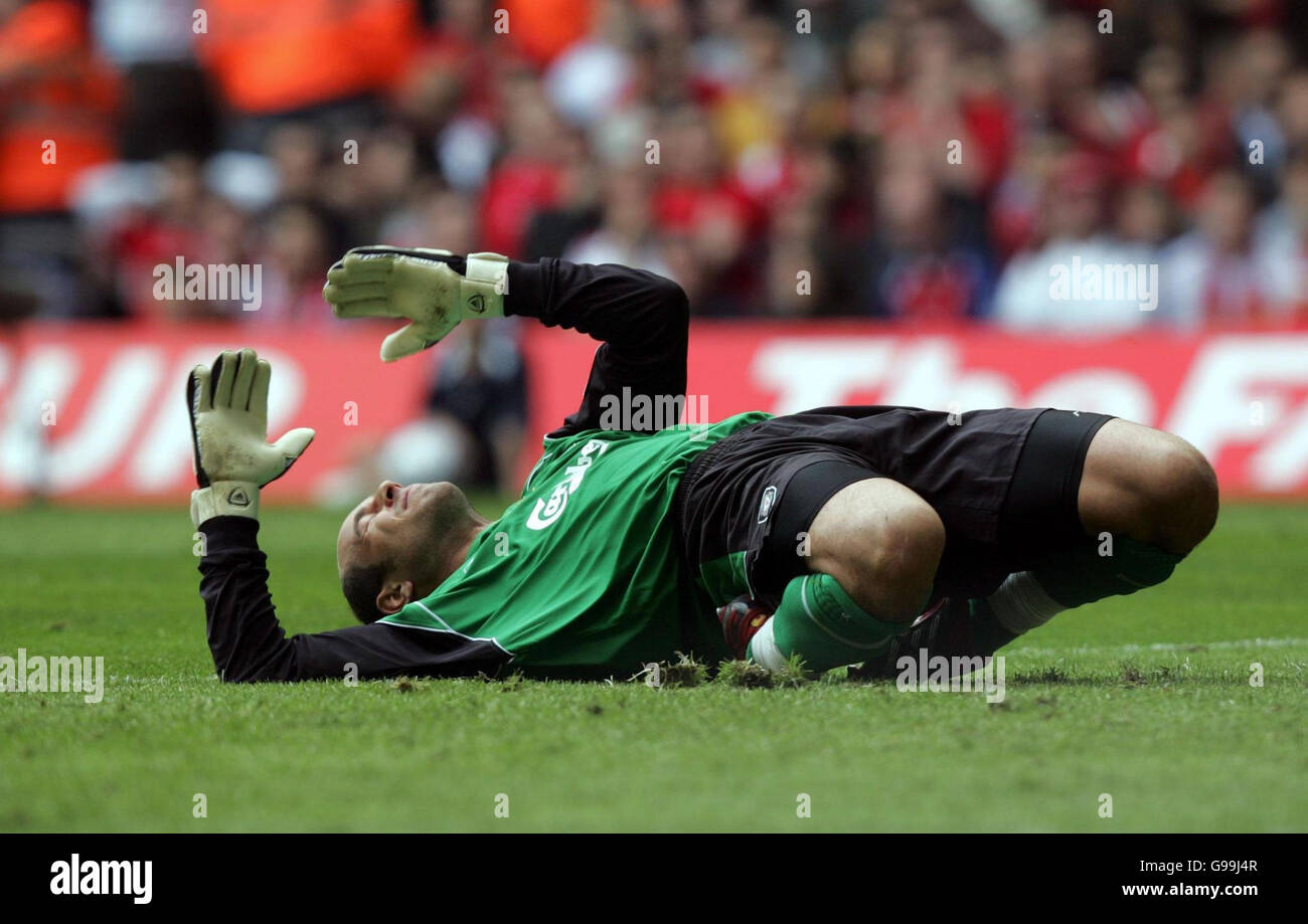 Liverpool goalkeeper Jose Reina looks dejected after the seocnd West ...
