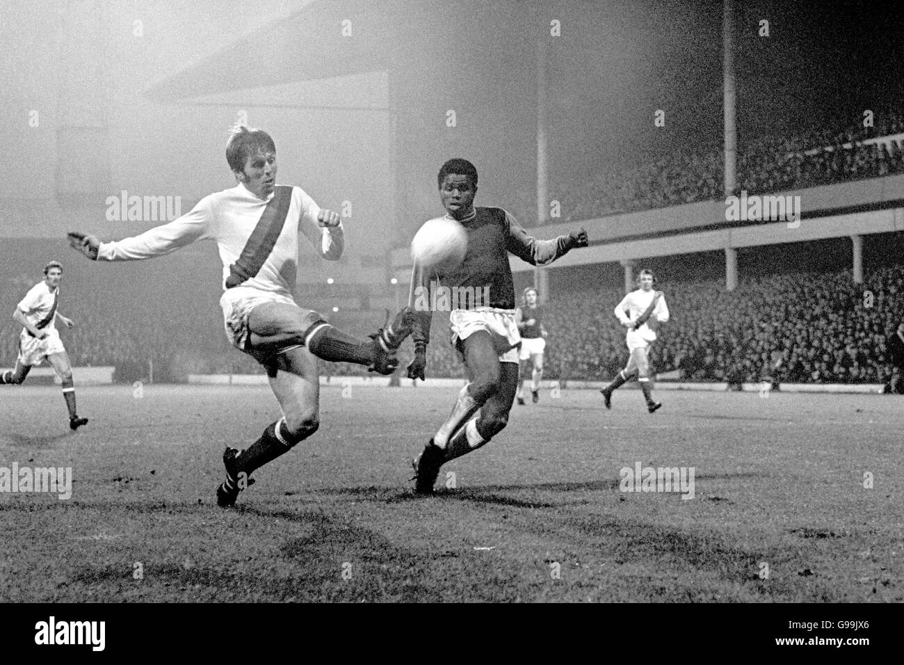 Manchester City's Alan Oakes (l) clears from West Ham United's Ade ...
