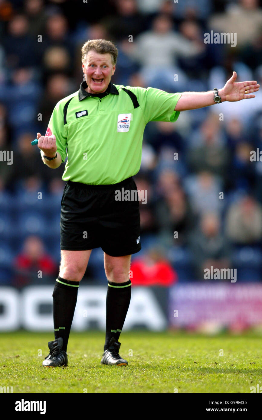 Referee Mick Fletcher gets the players attention during the game ...