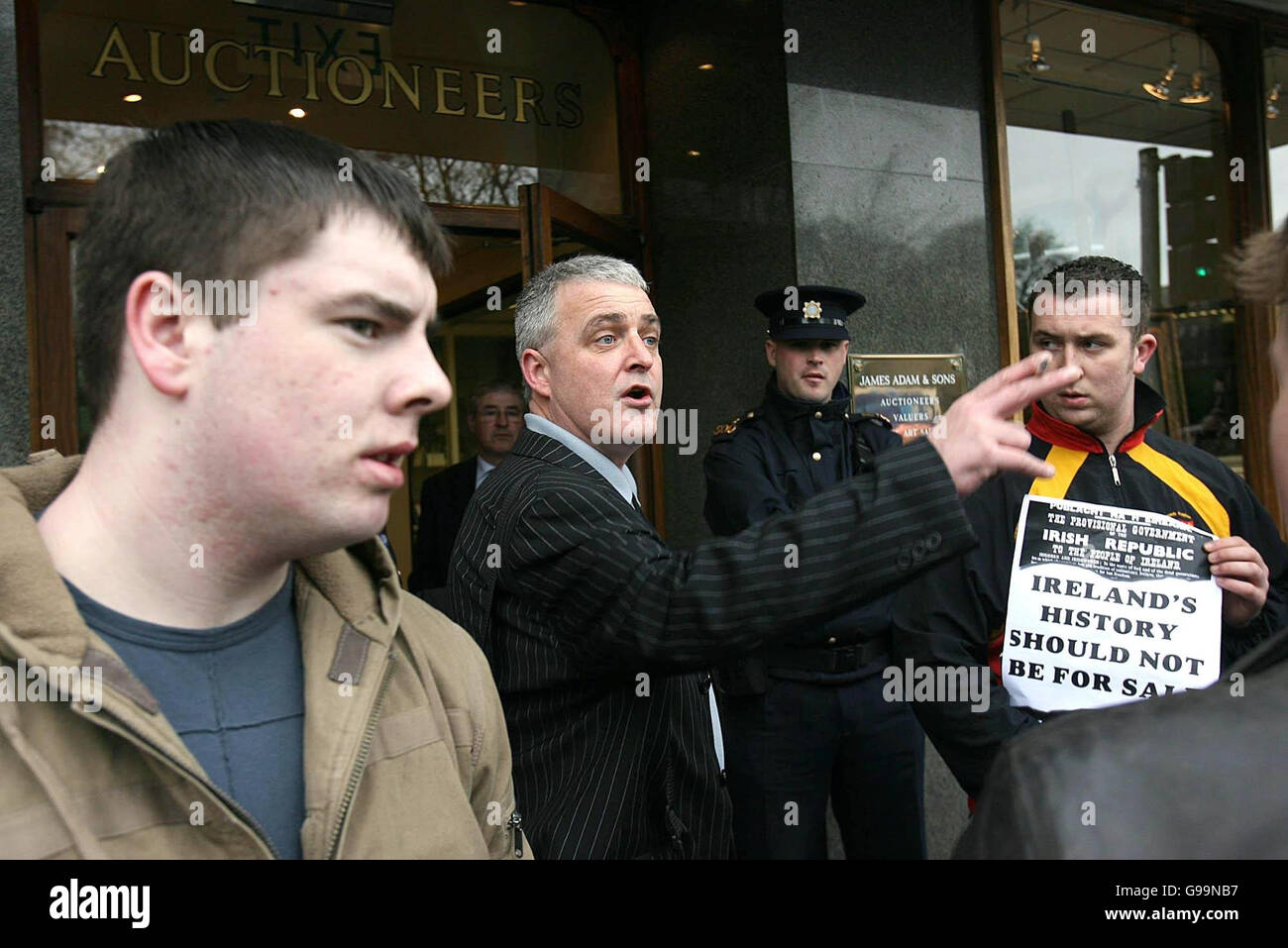 Sinn Fein North Antrim representative Martin McManus (centre) argues ...