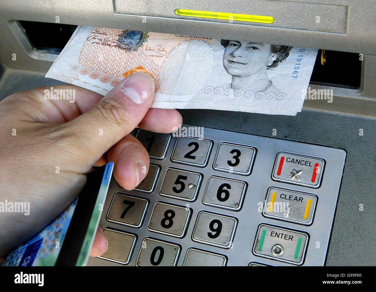 Person using a atm hi-res stock photography and images - Alamy