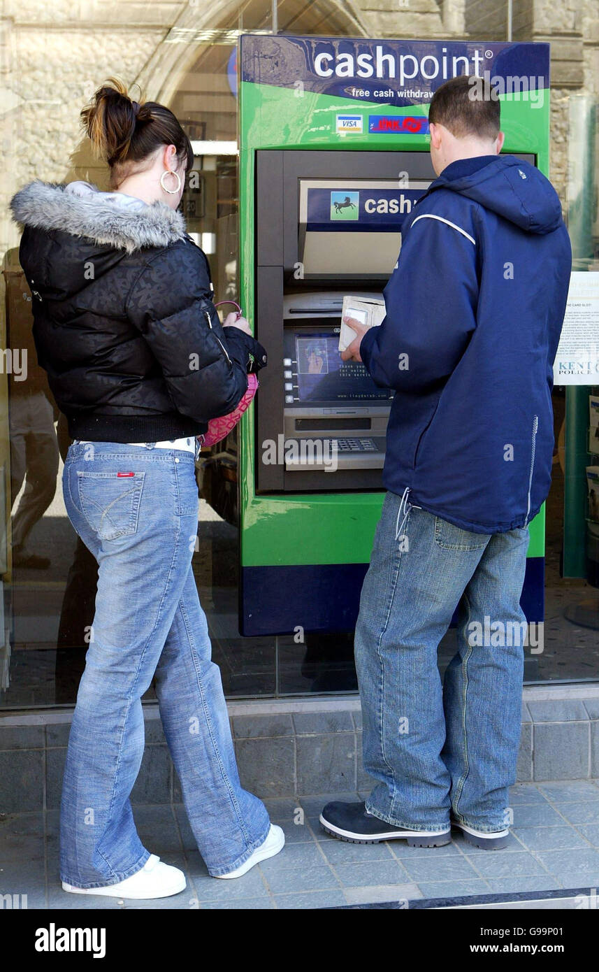 Cashpoint. A person using a cashpoint Stock Photo - Alamy