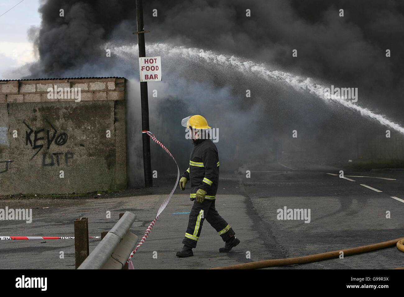 a Fire fighter walks past the scene in Lurgan Co Armag following a ...