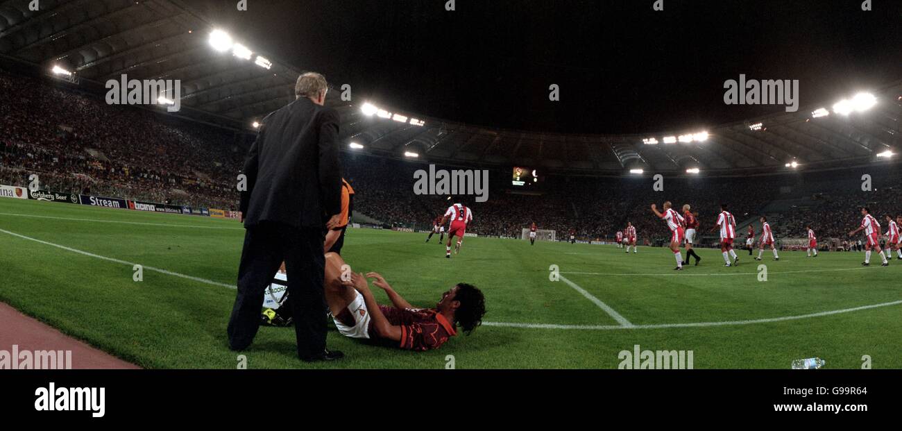 An injured roma player is treated at pitch side hi-res stock ...