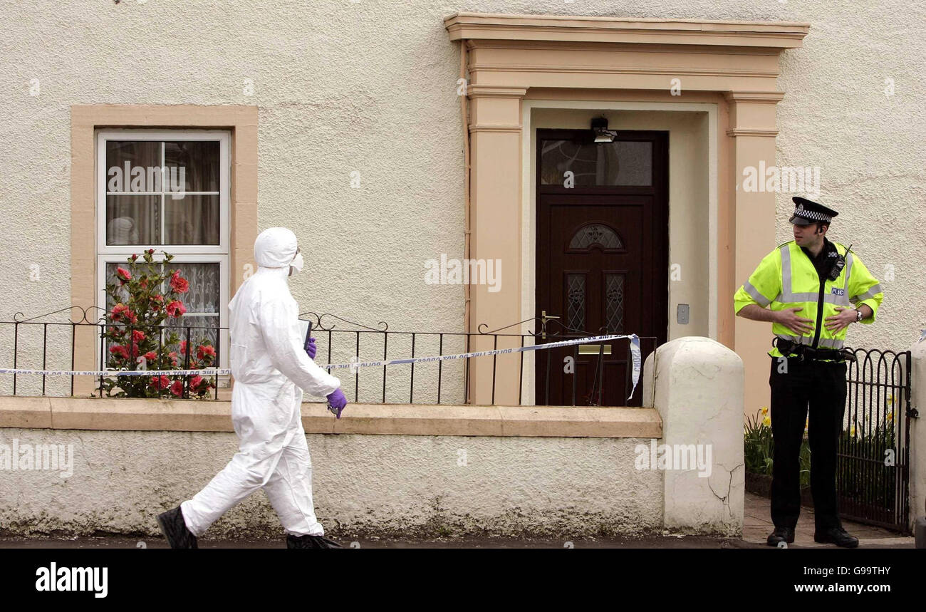 POLICE Terror. A policeman and a forensic officer outside a house in ...
