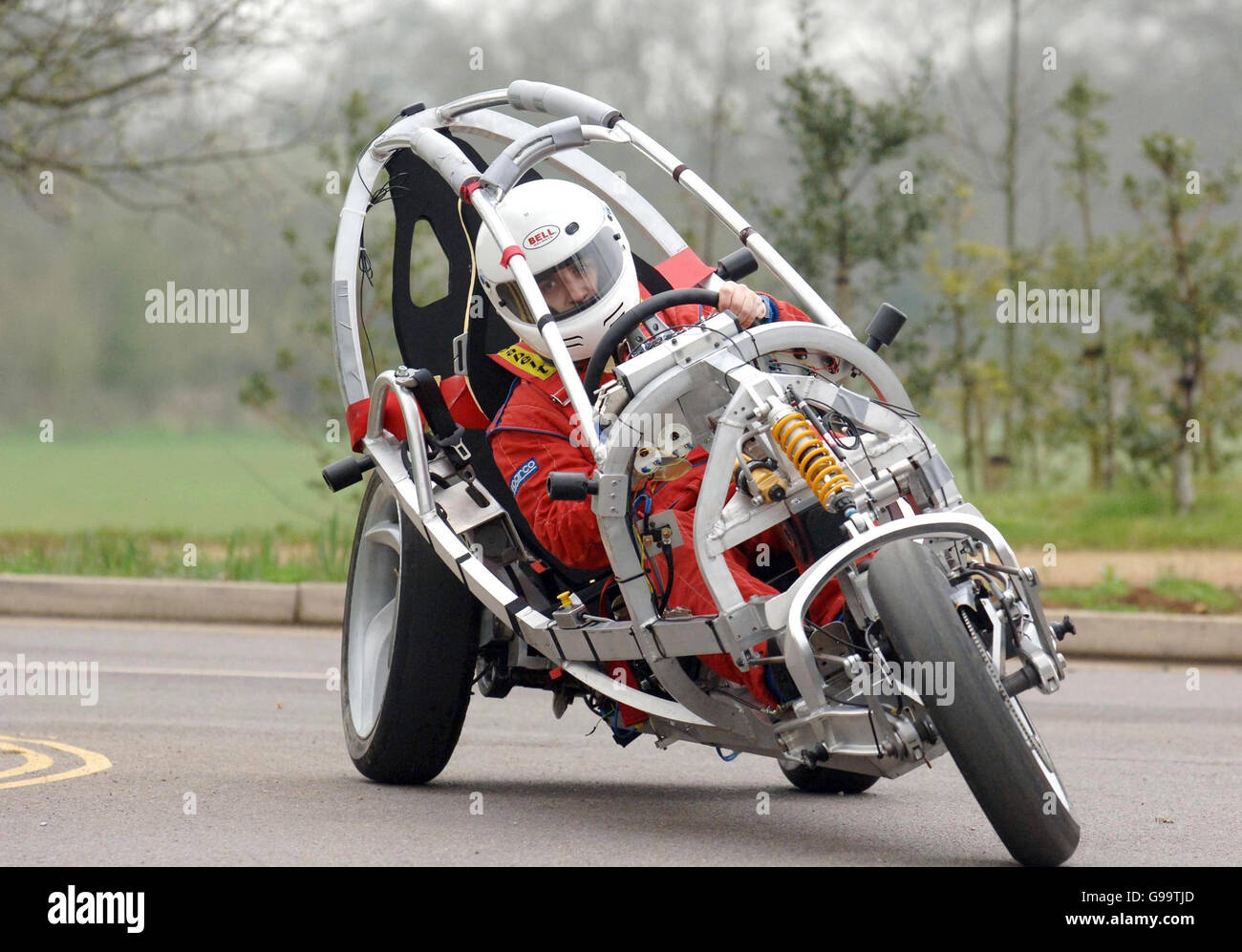 Researcher Matt Barker demonstrates how the CLEVER vehicle tilts when ...