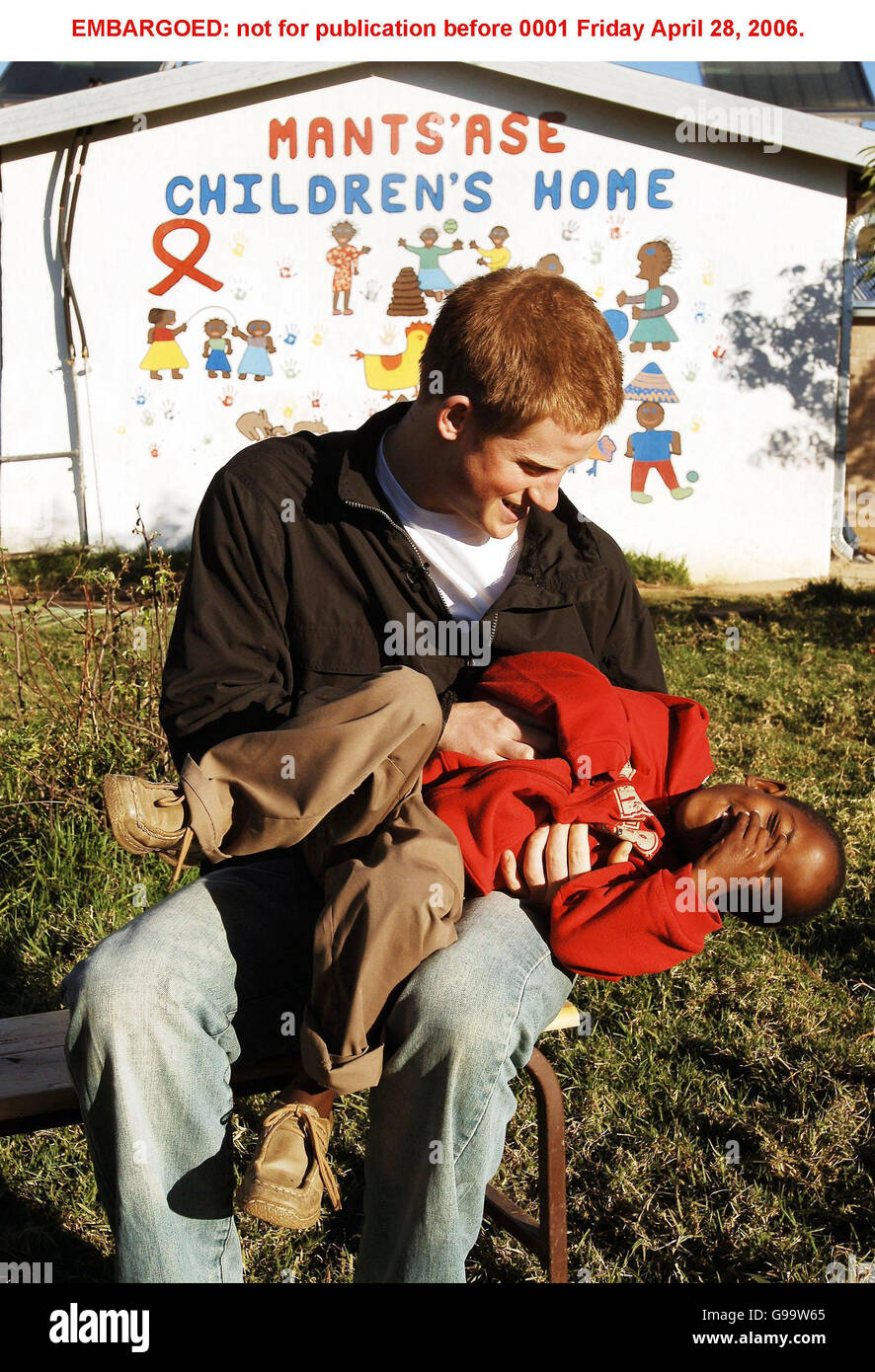 Prince Harry plays with Mutsu Potsane, 6, in the grounds of the Mants ...