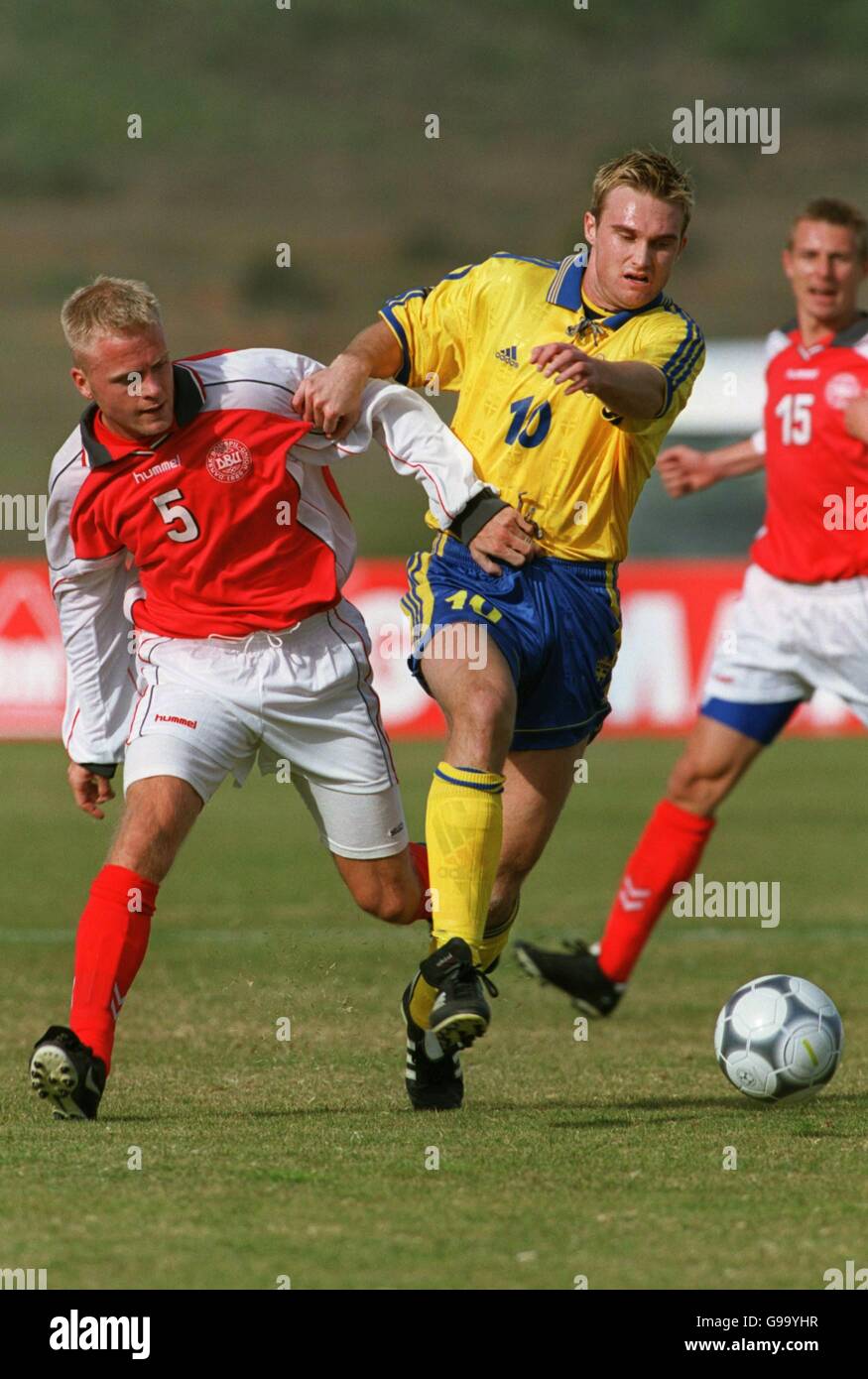 Sweden's Andreas Andersson (r) forces his way past Denmark's Allan ...