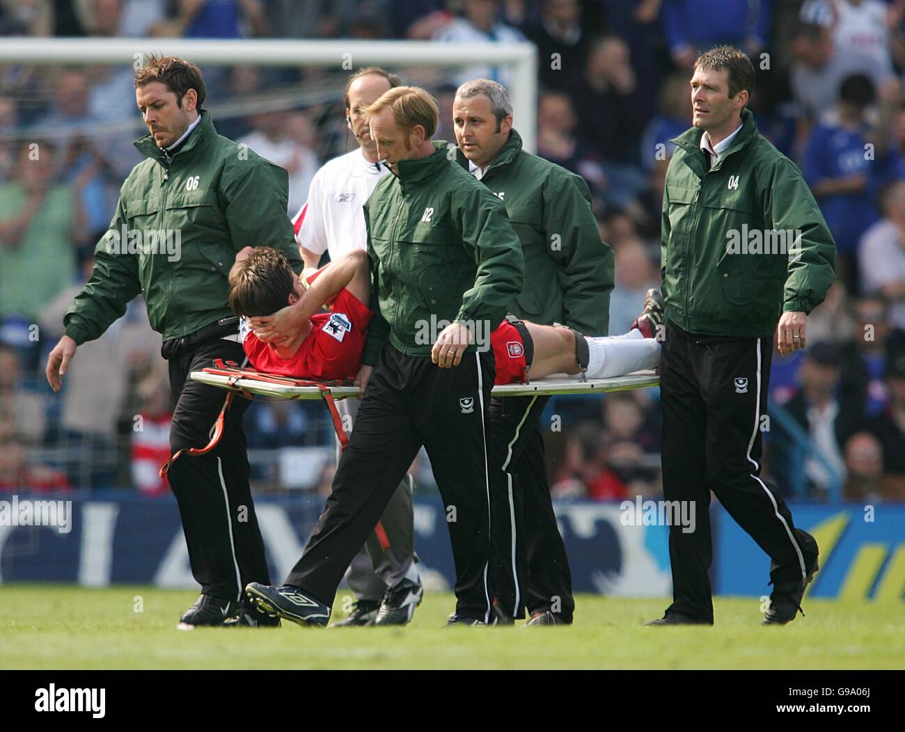 Liverpool's Xabi Alonso leaves the field on a stretcher Stock Photo - Alamy