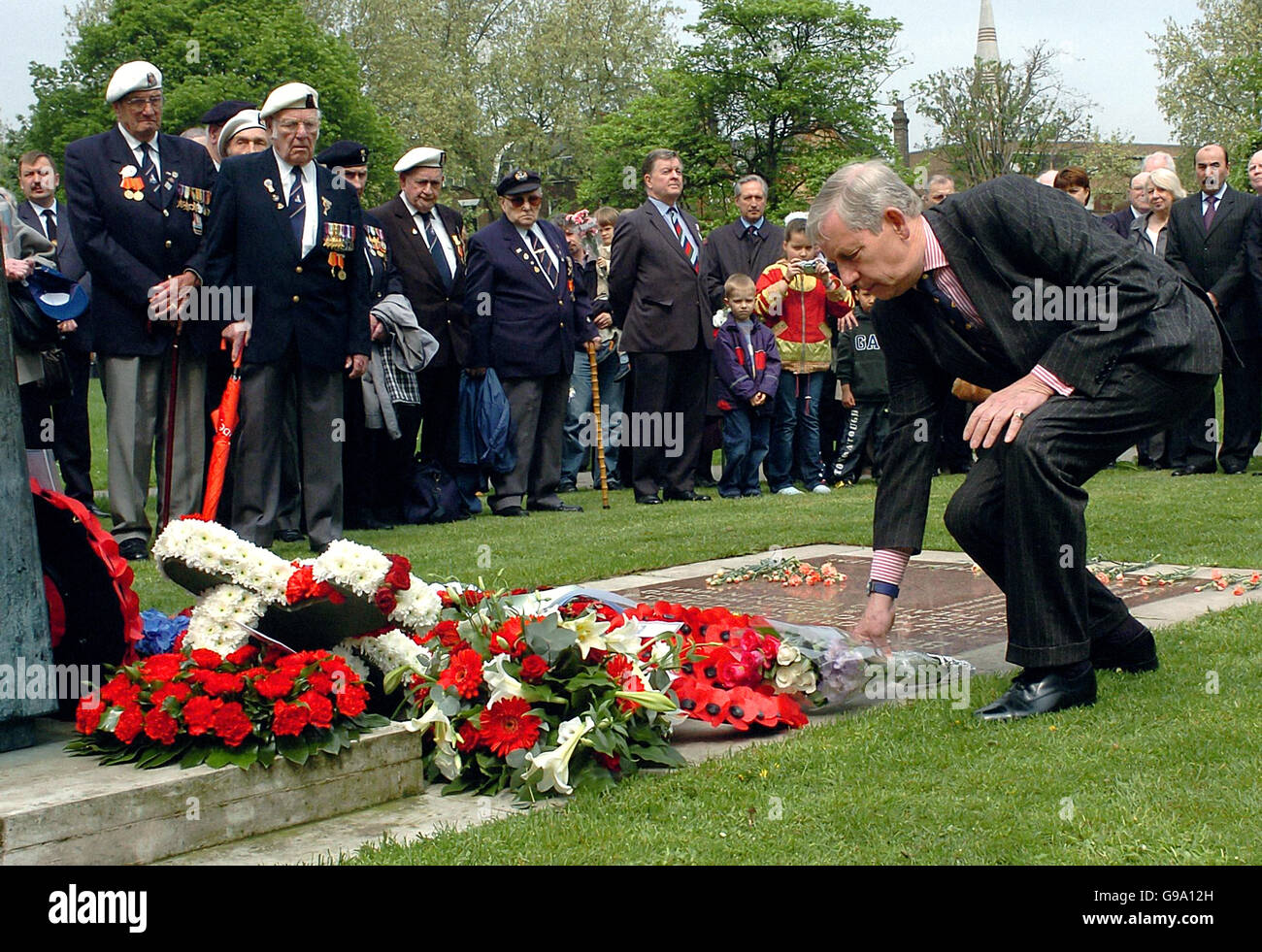 Air Commodore Philip Wilkinson lays a wreath from the Soviet Memorial ...