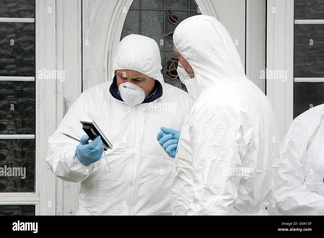 A Gardai forensic team examines the house on Ratoath Avenue, Finglas ...