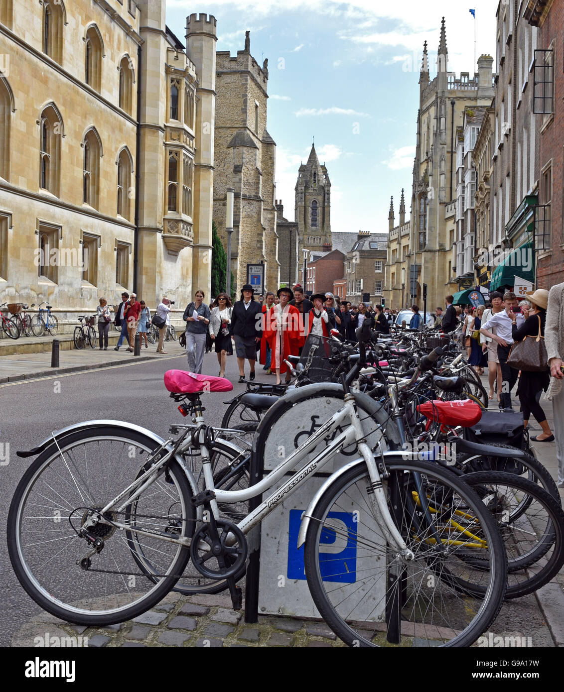 A parade of students is lead by professors at Cambridge University ...