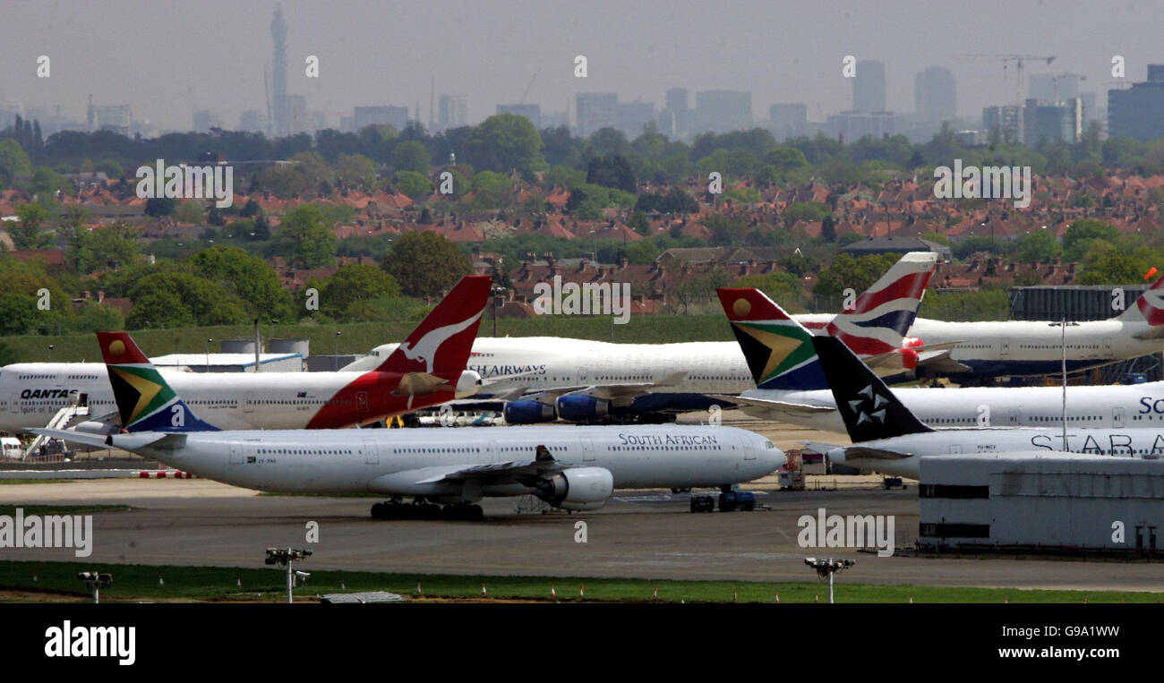 A view of aircraft at Heathrow Airport with the London skyline in the ...