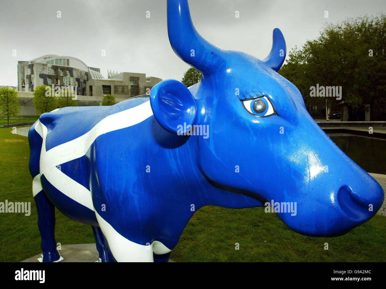 Salty the cow, one of 94 cows making up the CowParade stands outside ...