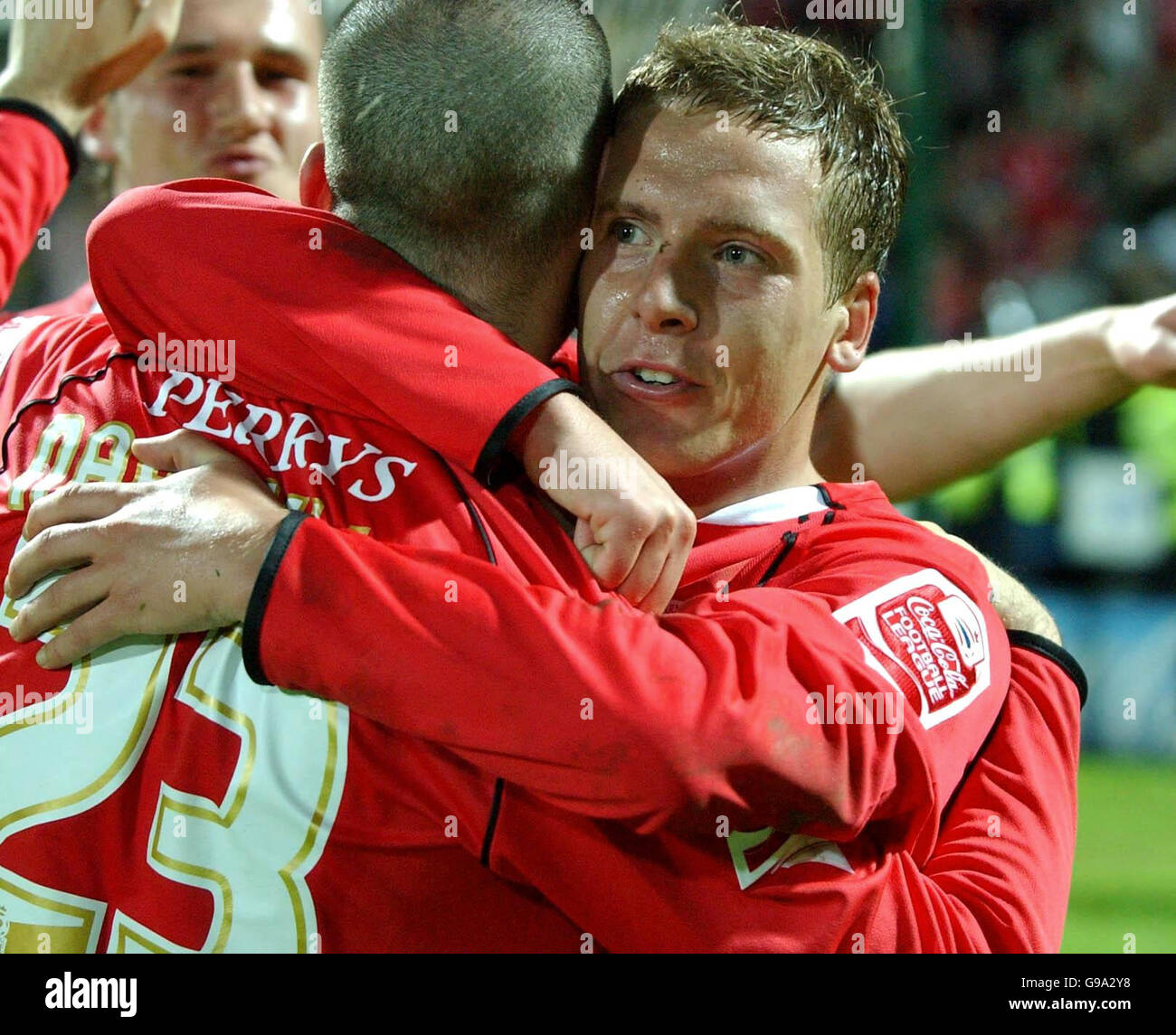 Barnsley's Brian Howard (R) celebrates with team-mate Danny Nardiello ...