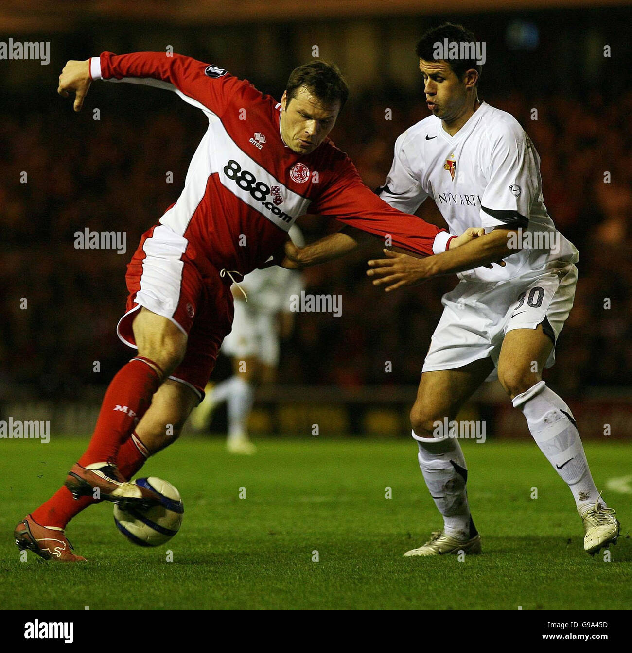 Middlesbrough's Mark Viduka (L) runs at Basle's Boris Smiljanic during ...