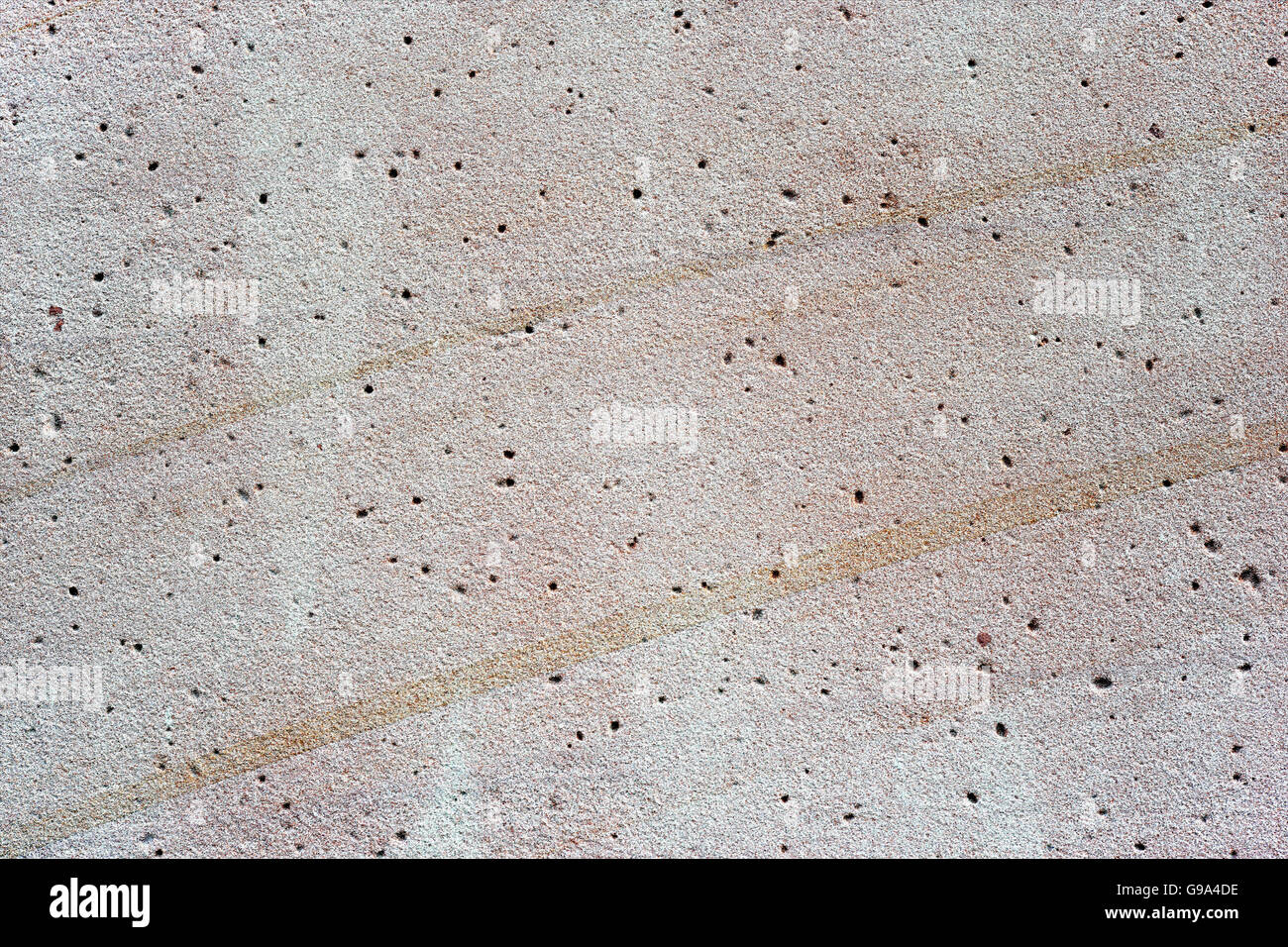 Light-colored sandstone with small holes as wallpaper Stock Photo - Alamy