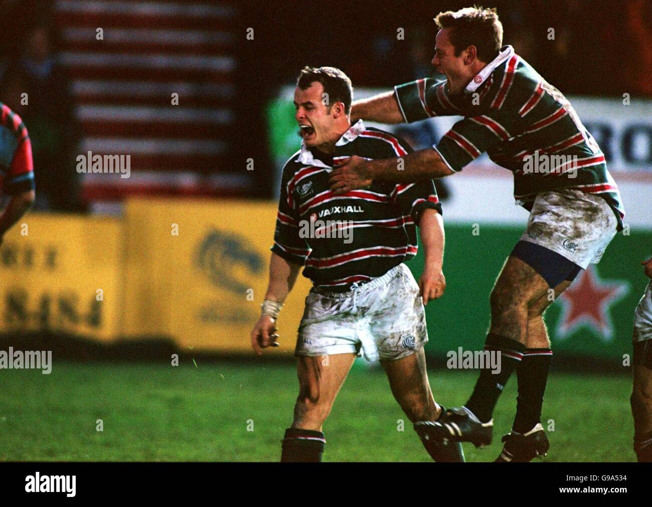 Leicester's Austin Healey celebrates his try with Pat Howard Stock ...