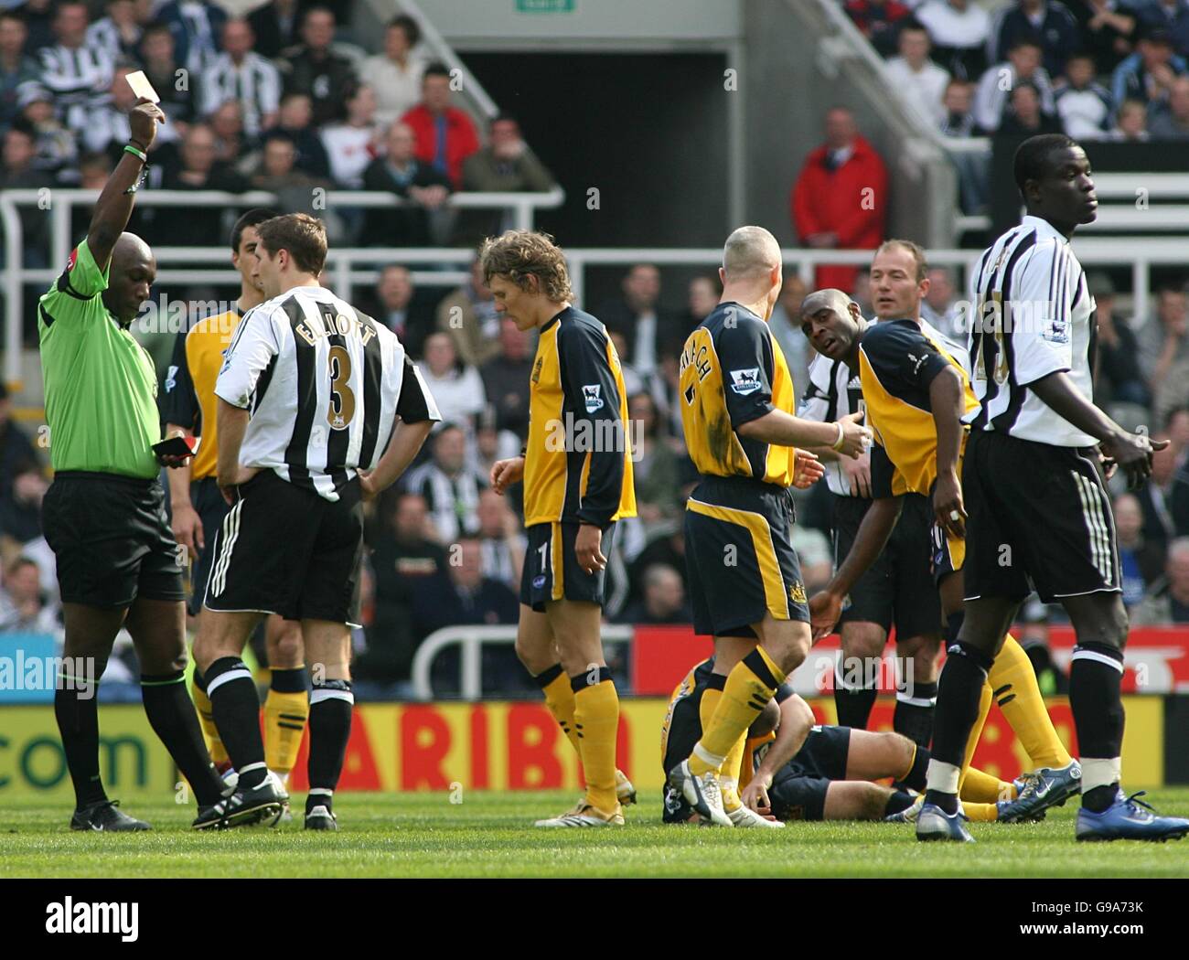Newcastle uniteds robbie elliott is booked by referee uriah rennie hi ...