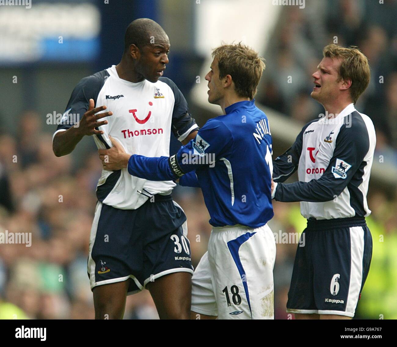 Everton's Phil Neville (centre) and Tottenham Hotspur's Anthony Gardner ...