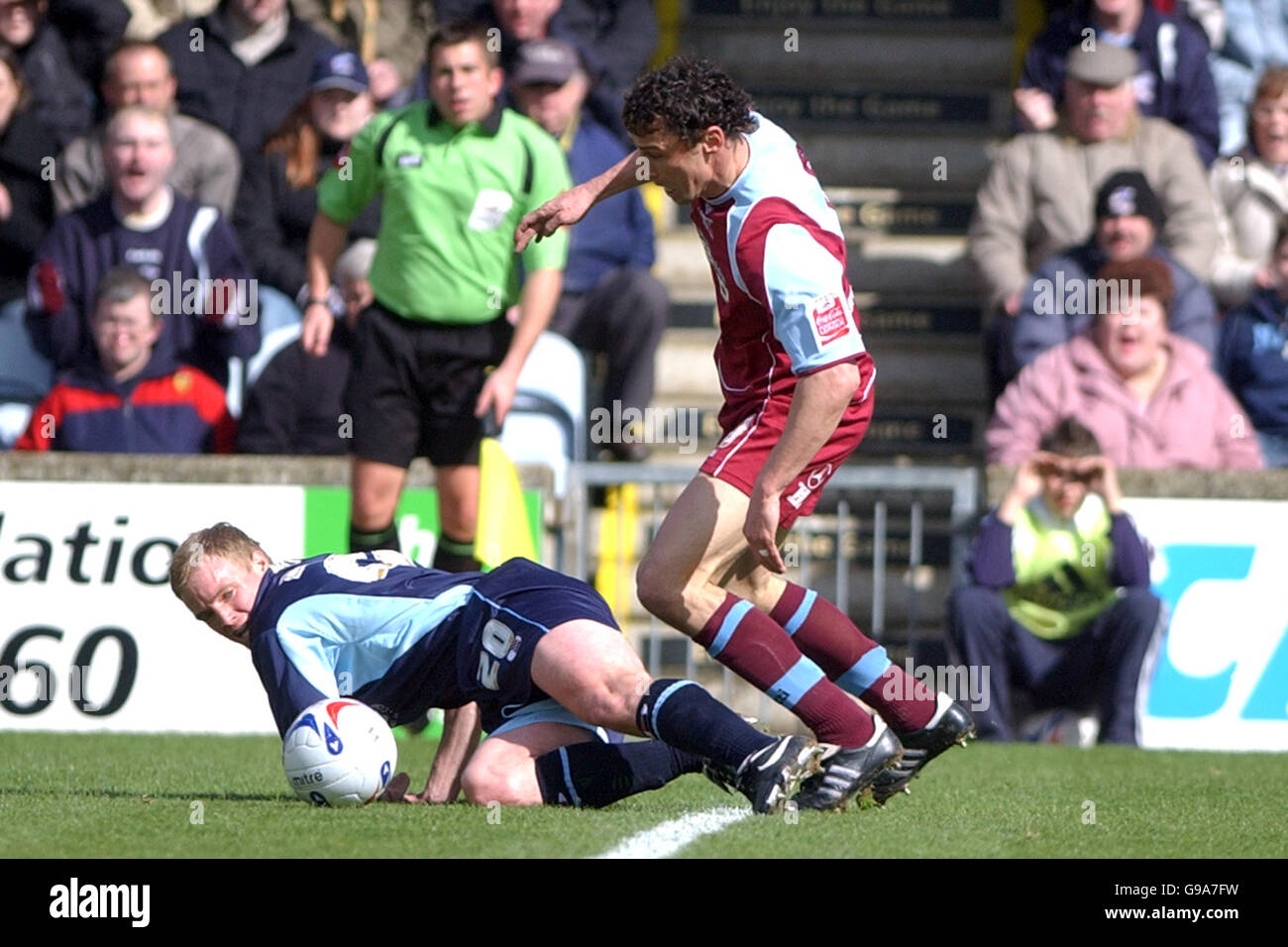 Scunthorpe United's Steve Torpey is brought down by Bournemouth's Eddie ...
