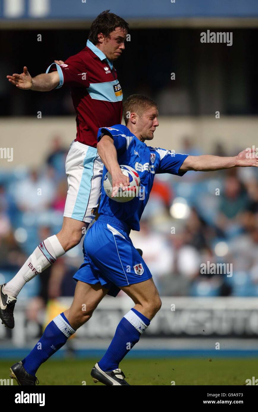 Millwall's Ben Mayand Burnley's Michael Duff battle for the ball Stock ...