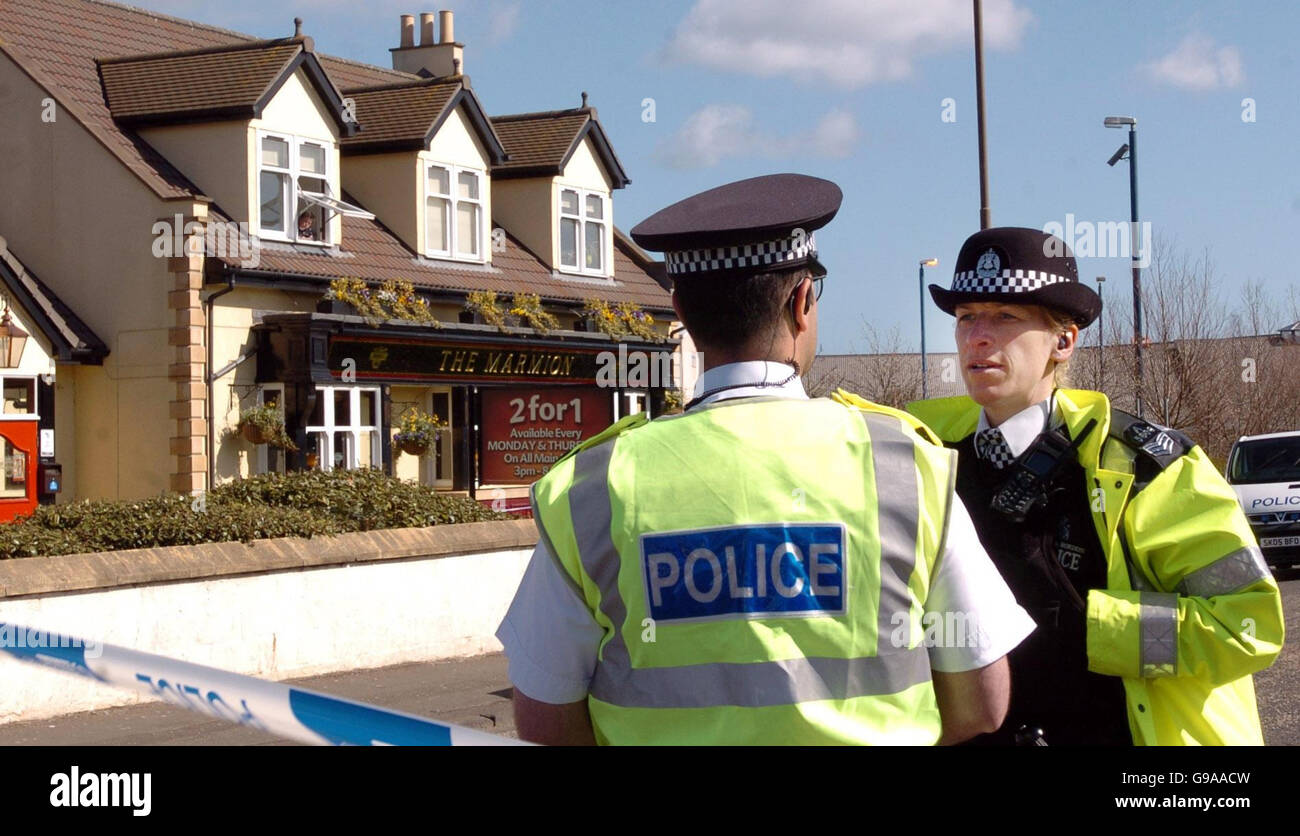 Police stand outside the Marmion pub in Edinburgh, the scene of a ...