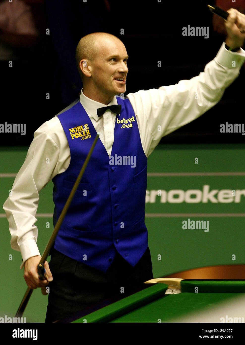 Peter Ebdon celebrates his victory over Shaun Murphy during the Quarter ...