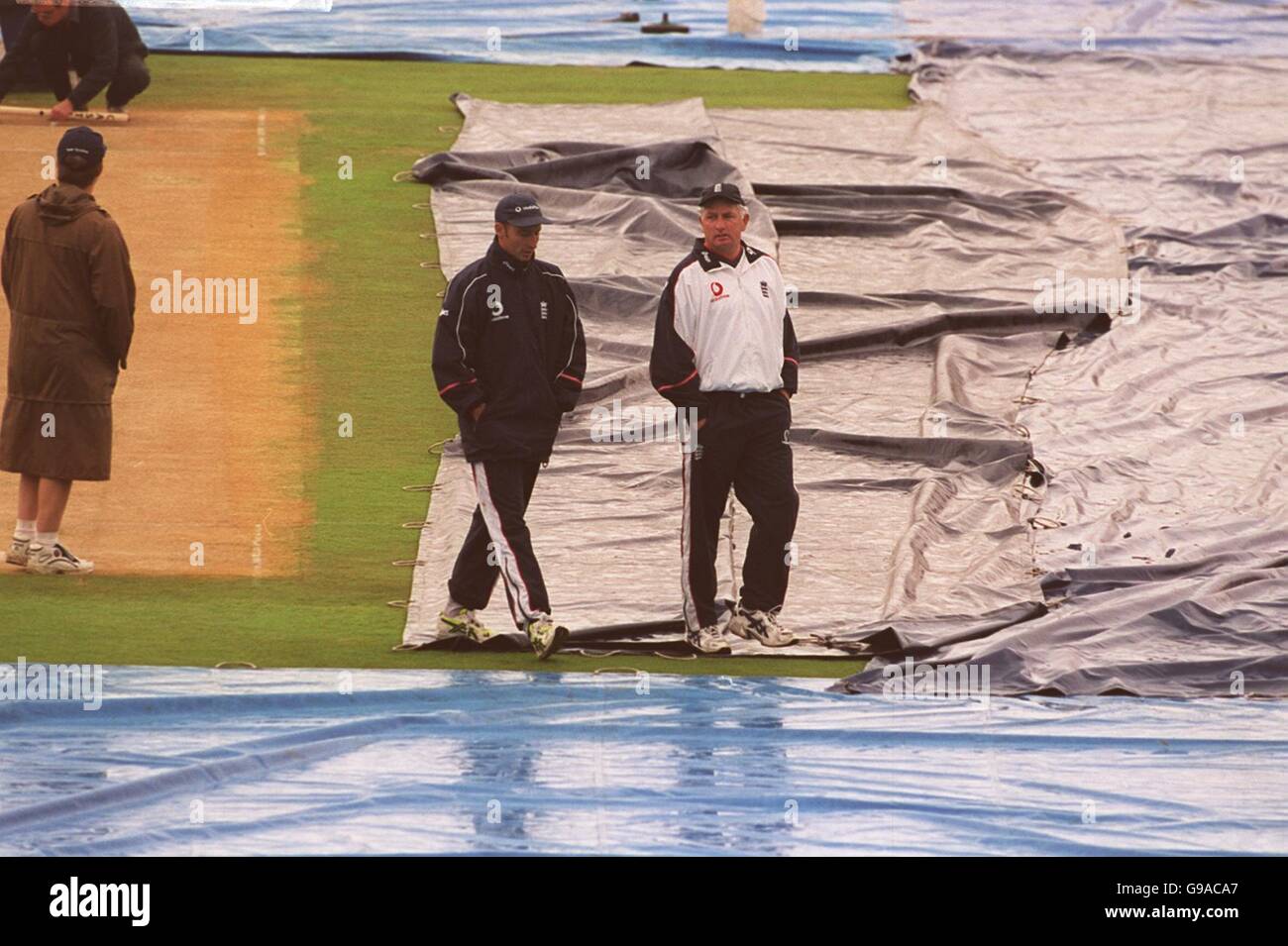 England captain Nasser Hussain (l) and coach Duncan Fletcher (r) leave ...