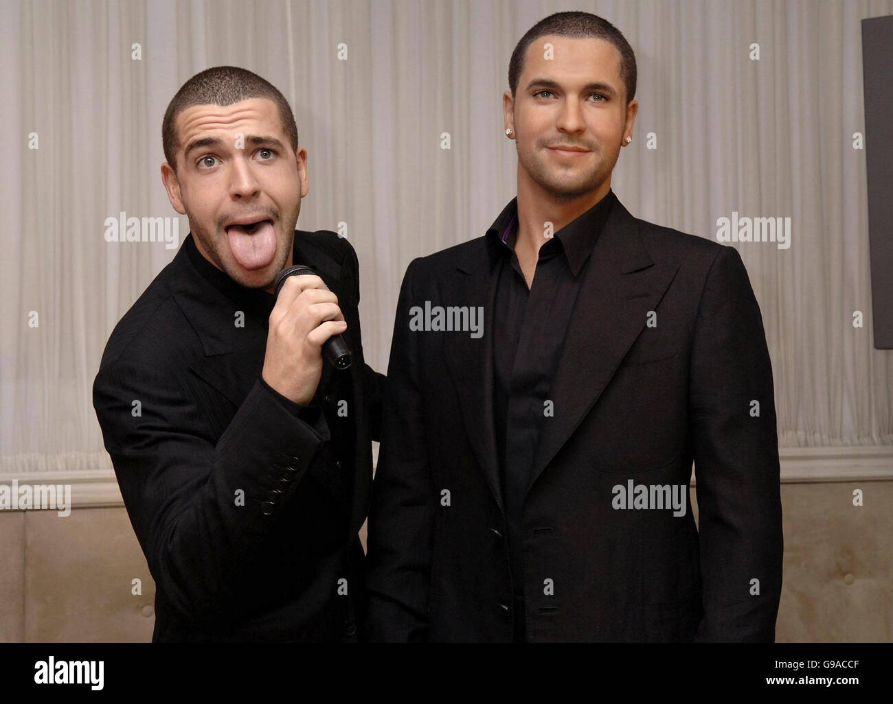 Showbiz tussauds half length mid eye contact smiling black suit hi-res ...