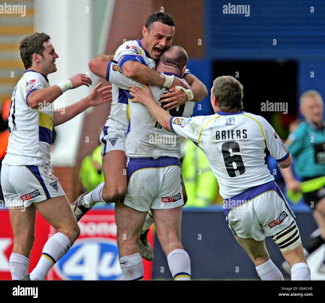 Warrington's Rob Parker (centre right) celebrates with-mate Jon Clarke ...