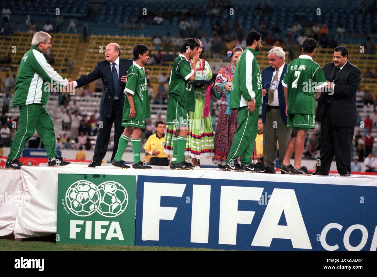 The dejected Saudi Arabia team are congratulated after finishing fourth ...