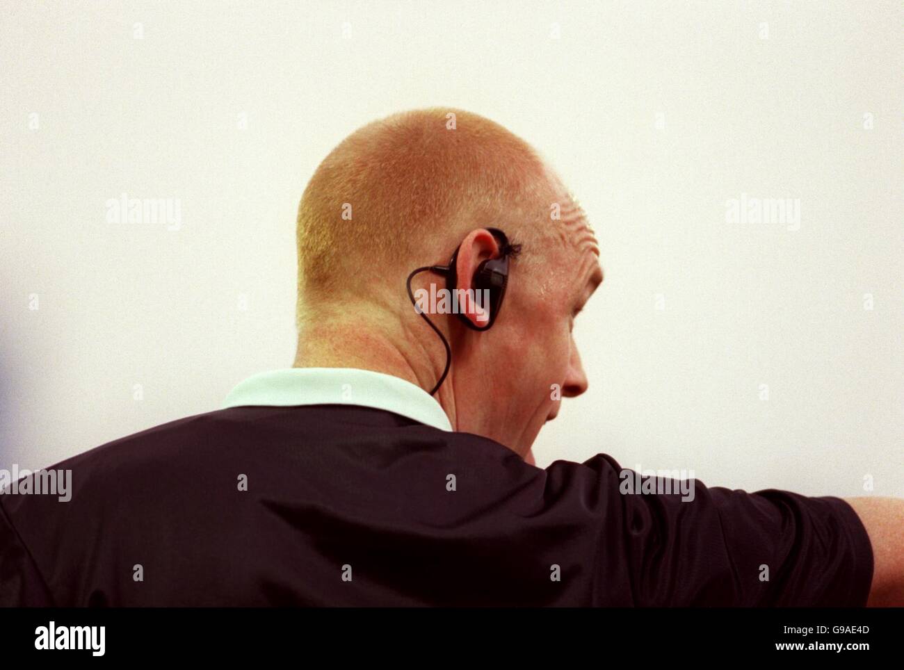 Wearing earpiece enable him communicate effectively referee hi-res ...