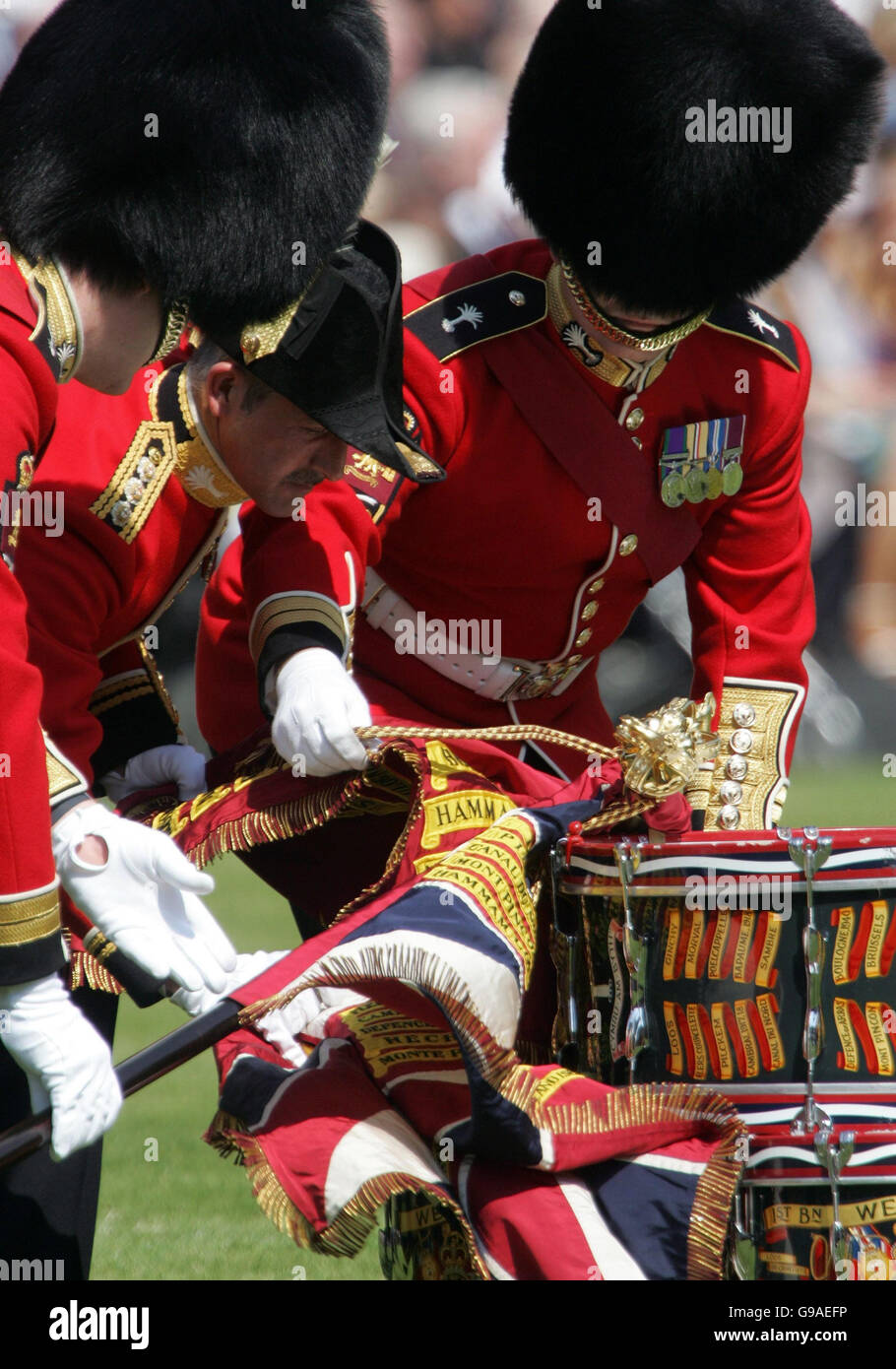The new colours (flag) is placed on a drum head for blessing during the ...
