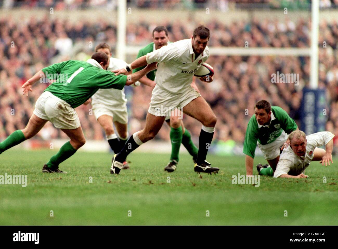 Ireland's Peter Clohessy (l) tries to tackle England's Simon Shaw (r ...
